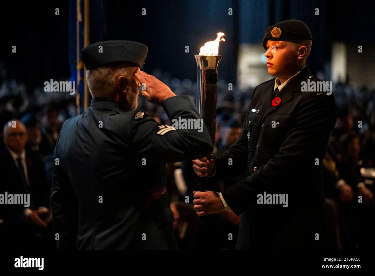The passing of the torch during Remembrance Day Ceremonies in Winnipeg ...