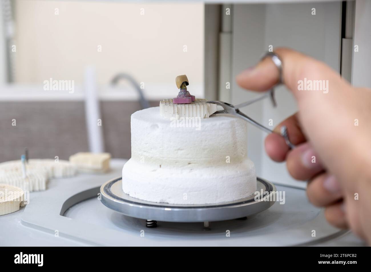 Crowns oven with crown on gypsum holder with humans to prevent heat ...