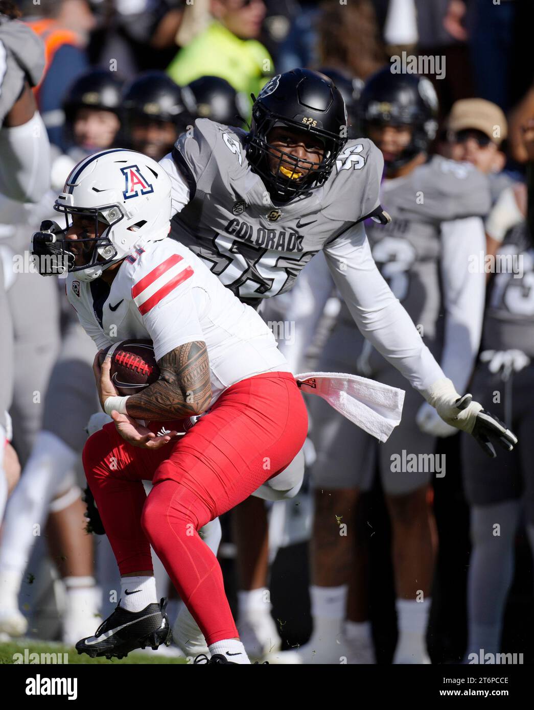 Arizona quarterback Noah Fifita, left, is stopped after a short gain by ...