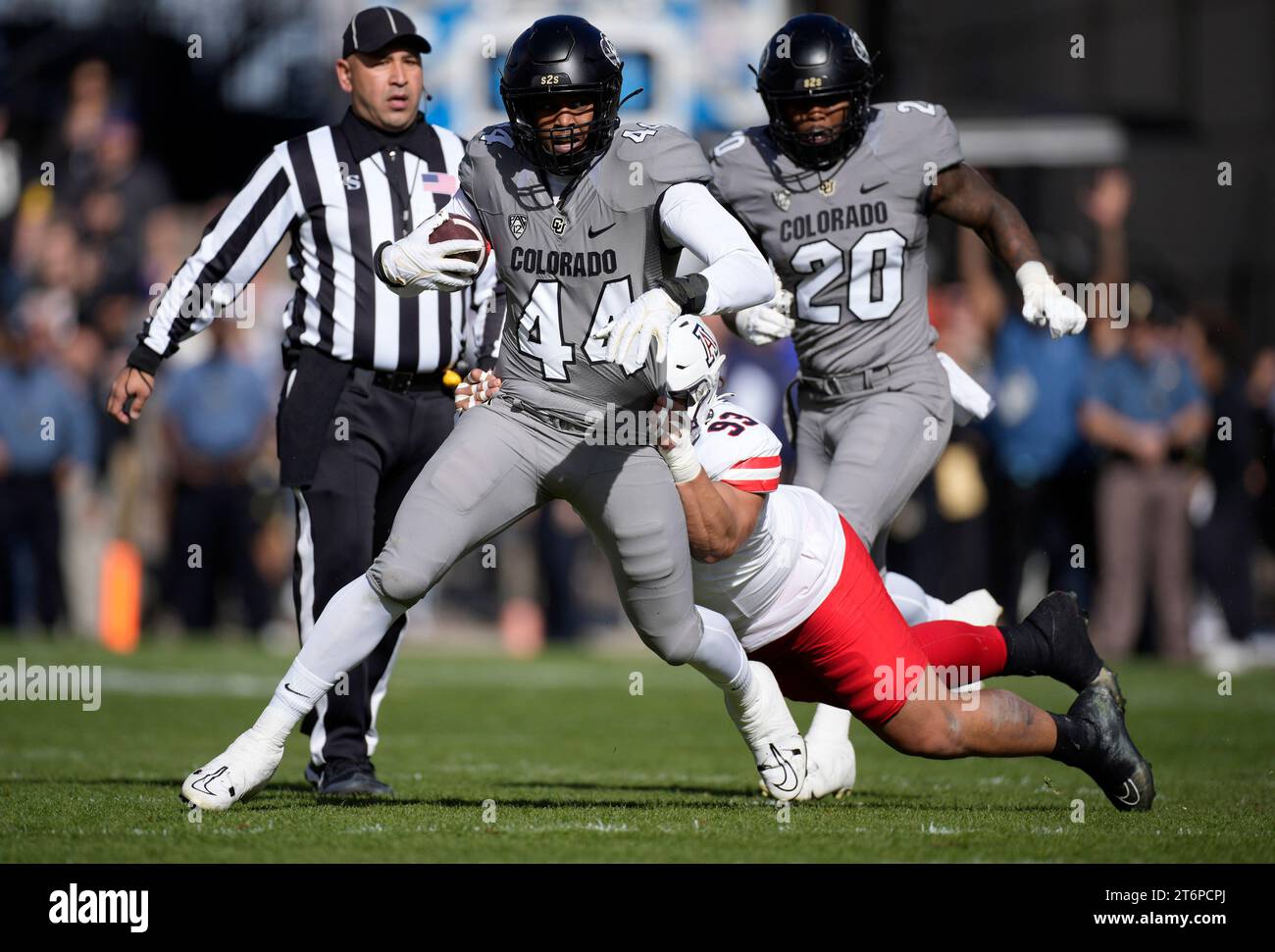 Colorado special teams player Charlie Offerdahl, left, is stopped by ...