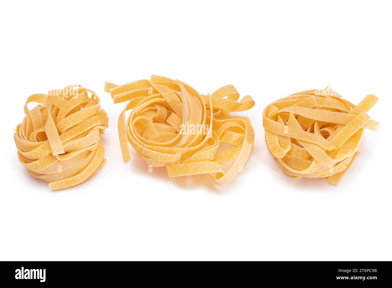 Three Classic Italian Raw Egg Fettuccine - Isolated on White Background ...