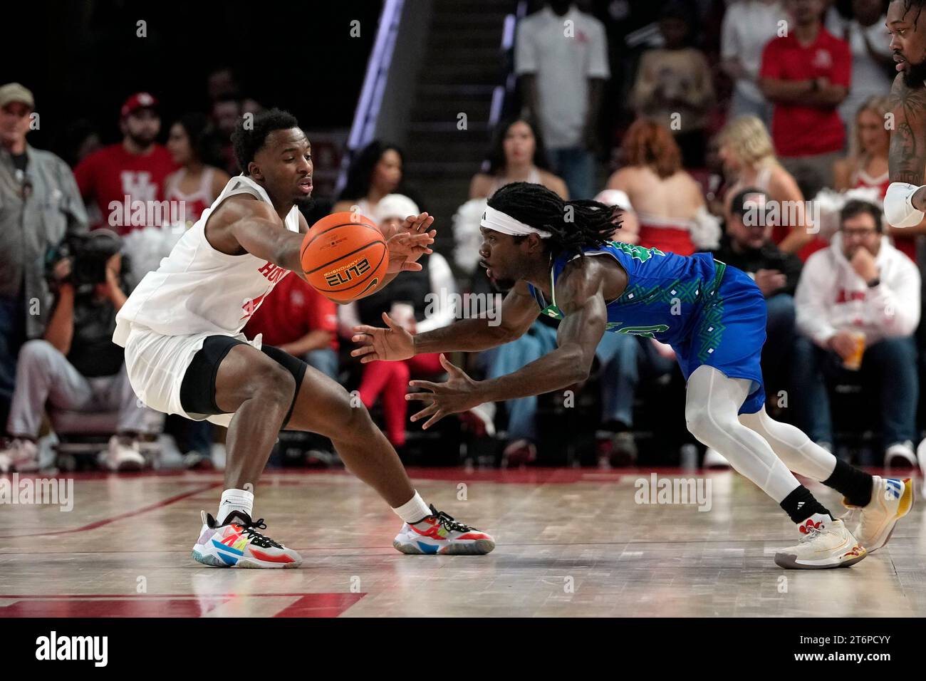 Houston's LJ Cryer (4) knocks the ball away from Texas A&M-Corpus ...