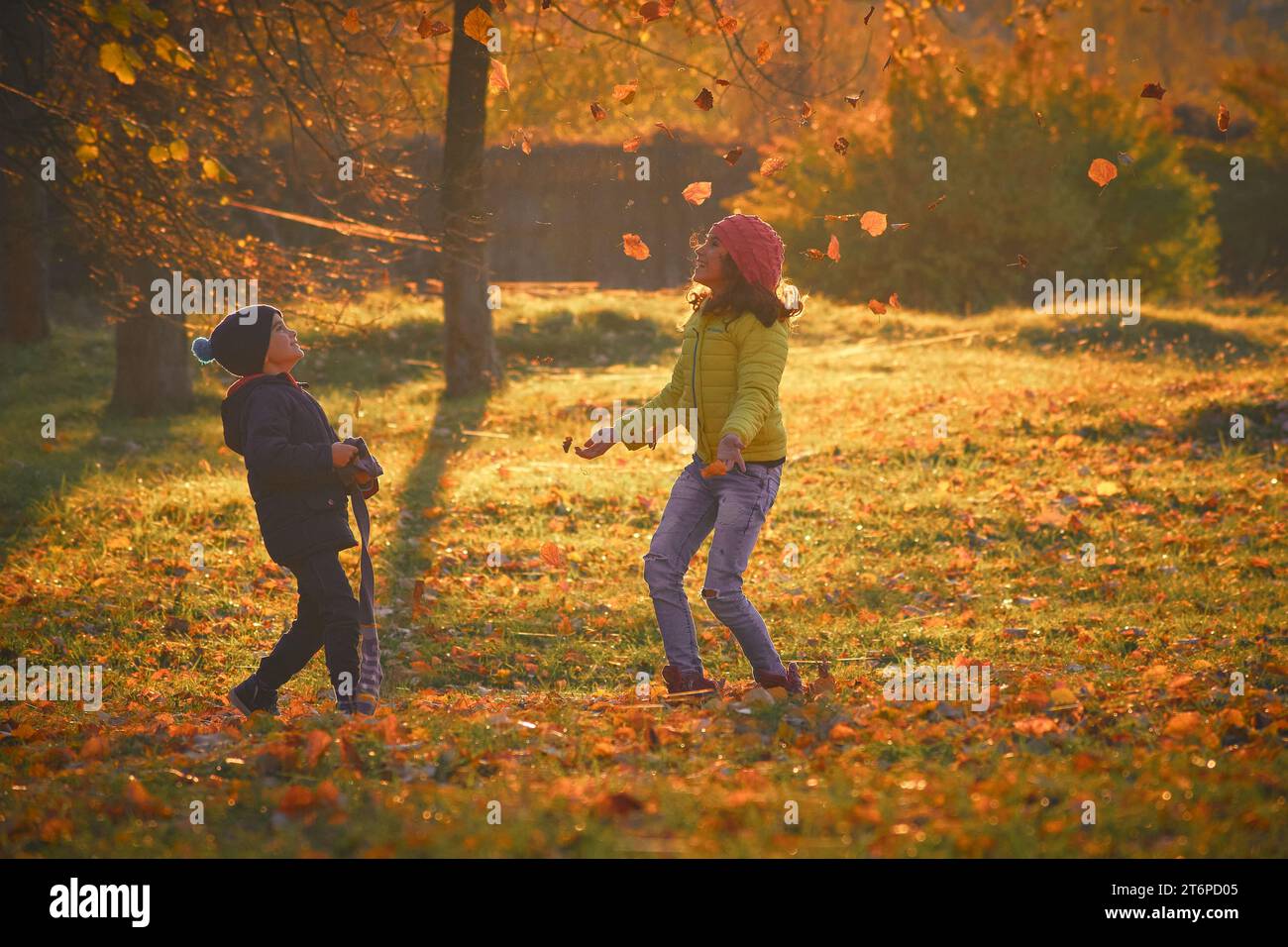 autumn landscape with children playing in the park Stock Photo - Alamy