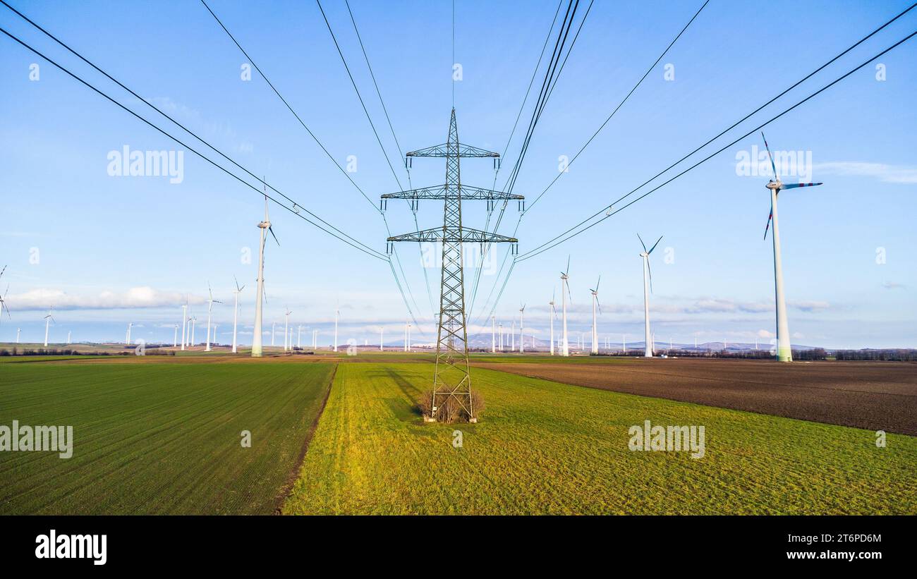 Cables and wires of an electrical power line with windmills for wind ...
