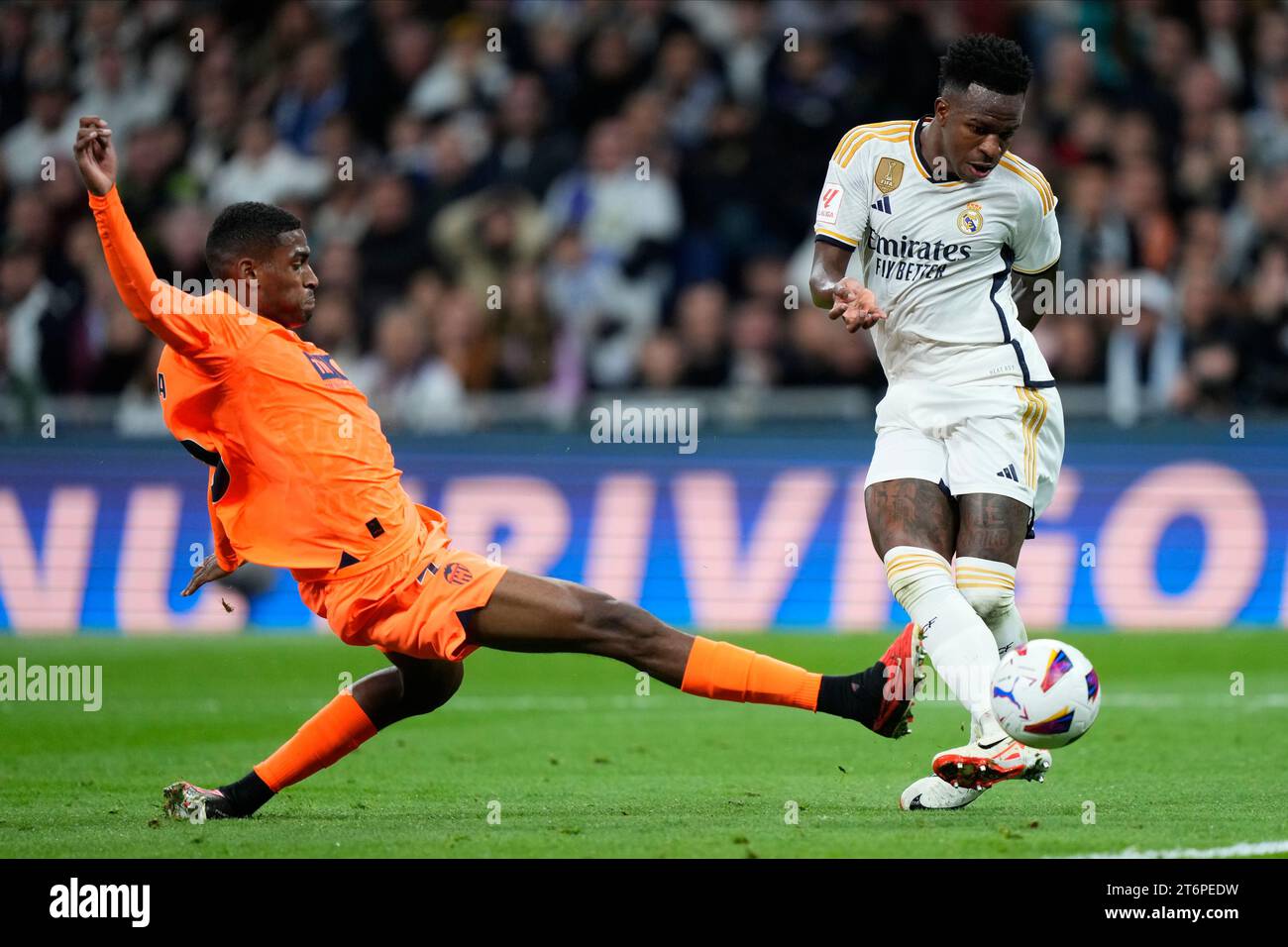 Vinicius Junior of Real Madrid CF and Cristhian Mosquera of Valencia CF ...
