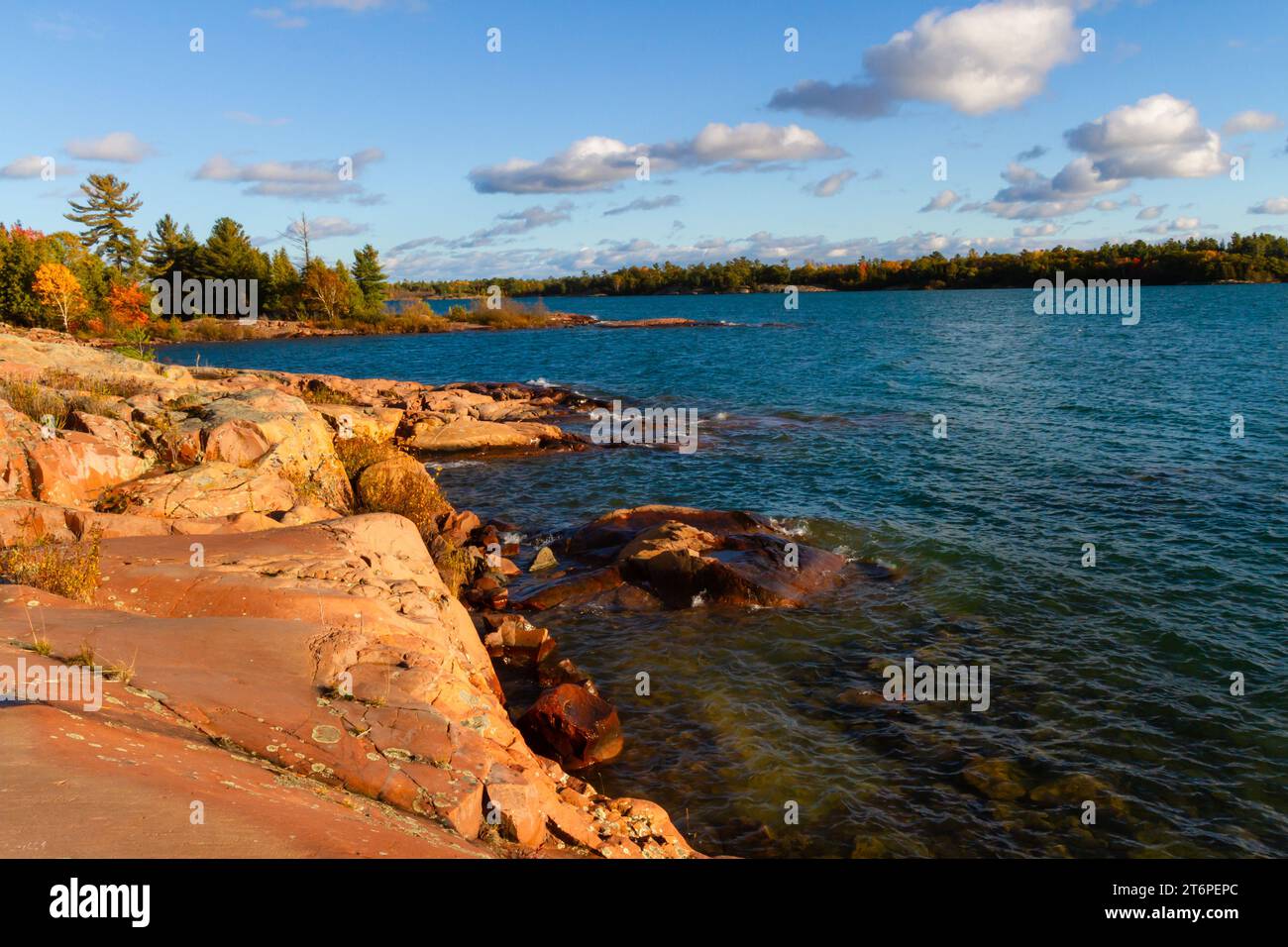 Shoreline along lake Huron. Granite Red rocks at the mouth of the ...