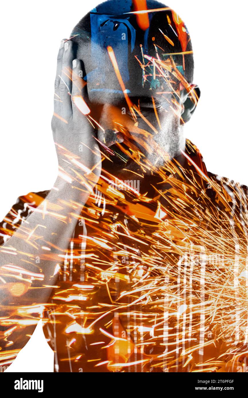 Man's overwhelmed expression beneath a storm of industrial sparks Stock ...