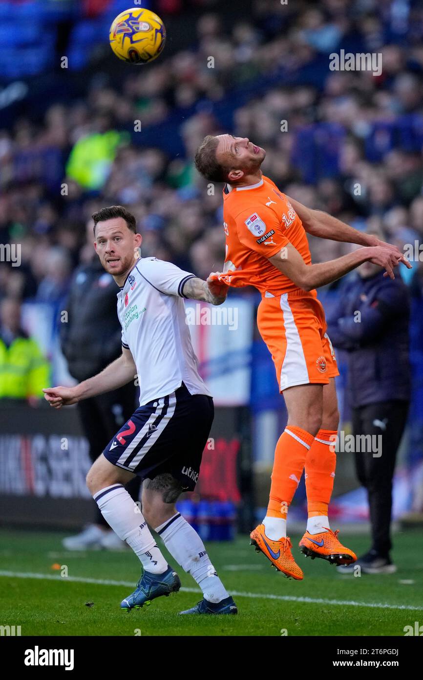 Jordan Rhodes #16 of Blackpool wins a header under pressure from Callum ...
