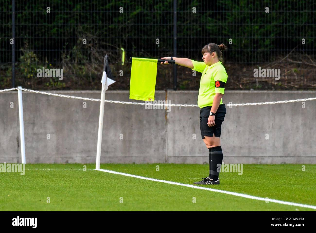 The assistant referee raises flag for offside hi-res stock photography ...