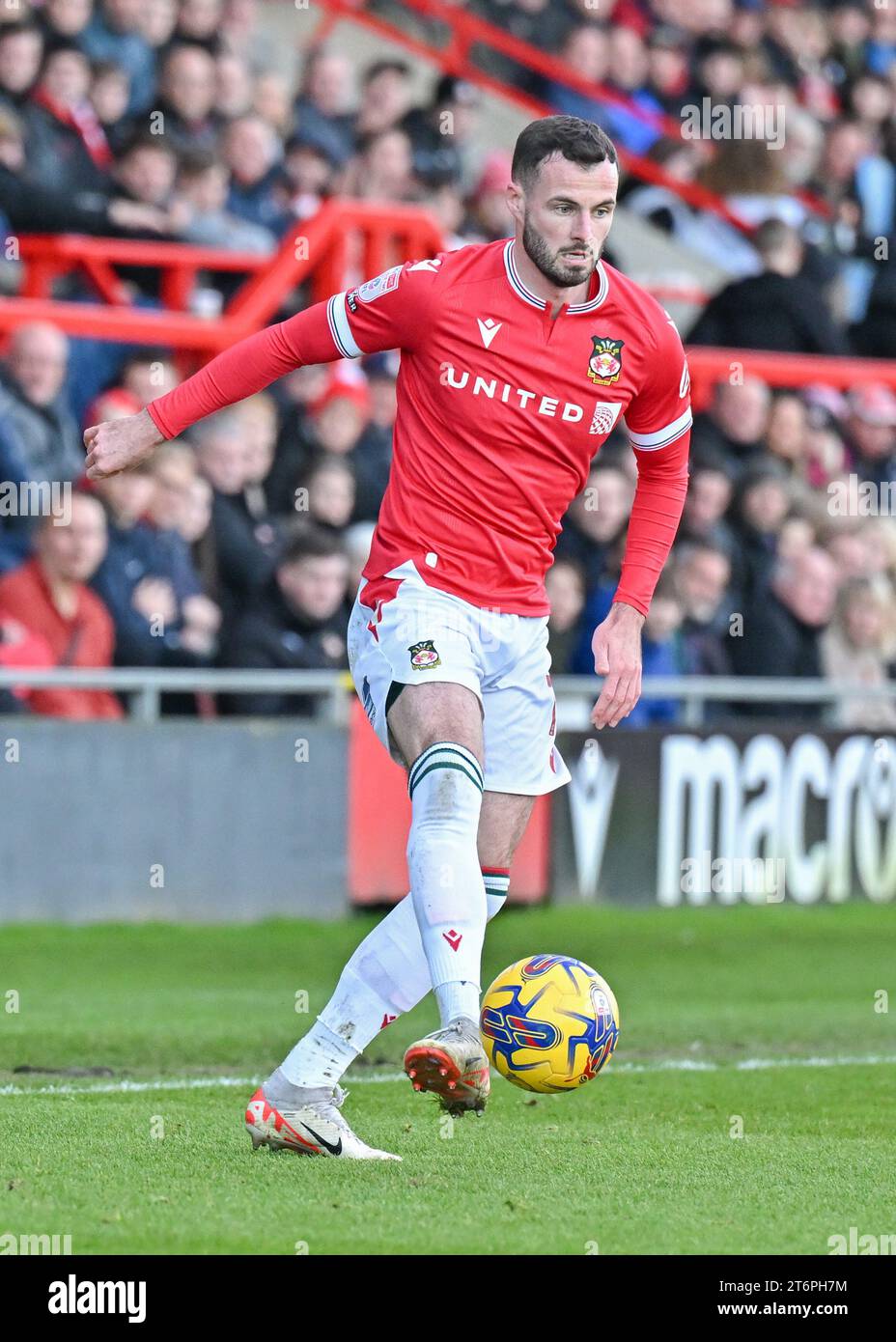 Anthony Forde 14# of Wrexham Association Football Club bring the ball ...