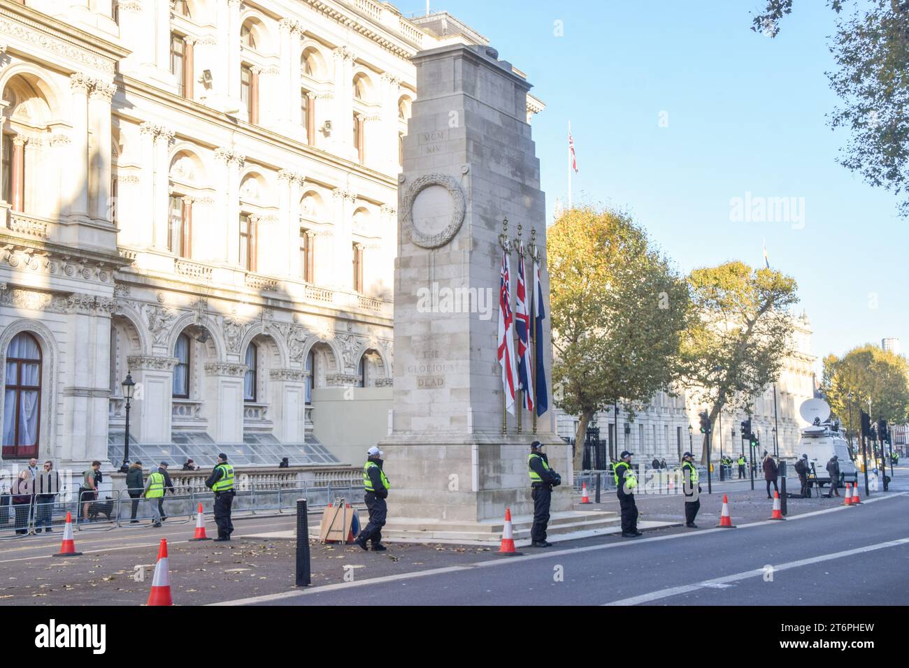 London, UK. 11th November 2023. Police officers guard The Cenotaph war ...