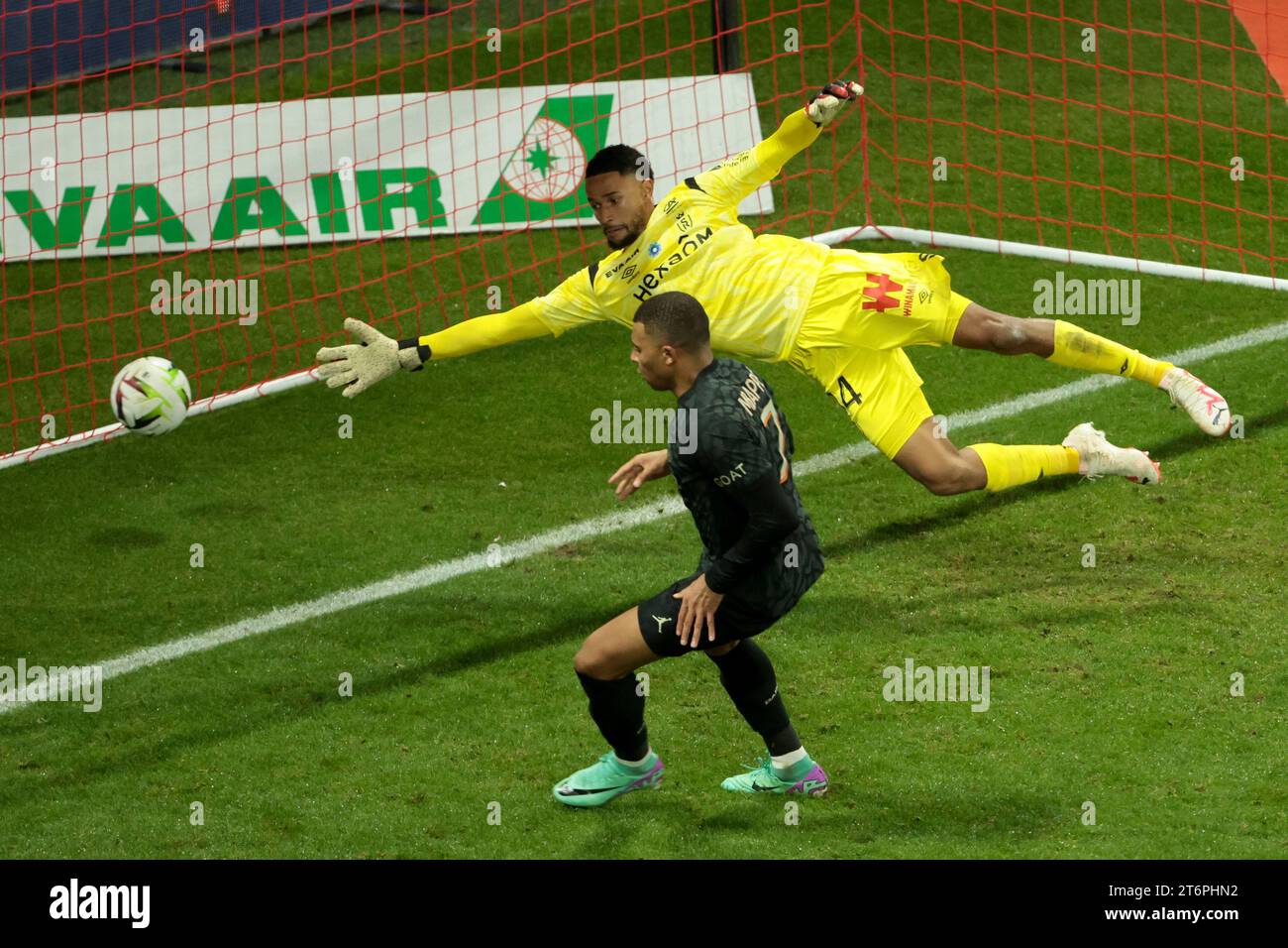 Kylian Mbappe of PSG scores his third goal against Reims goalkeeper ...