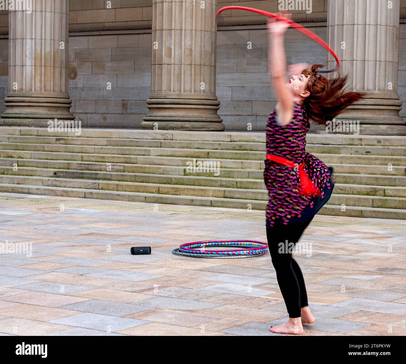 A young woman hula hooping at Dundee's City Square in front of the ...