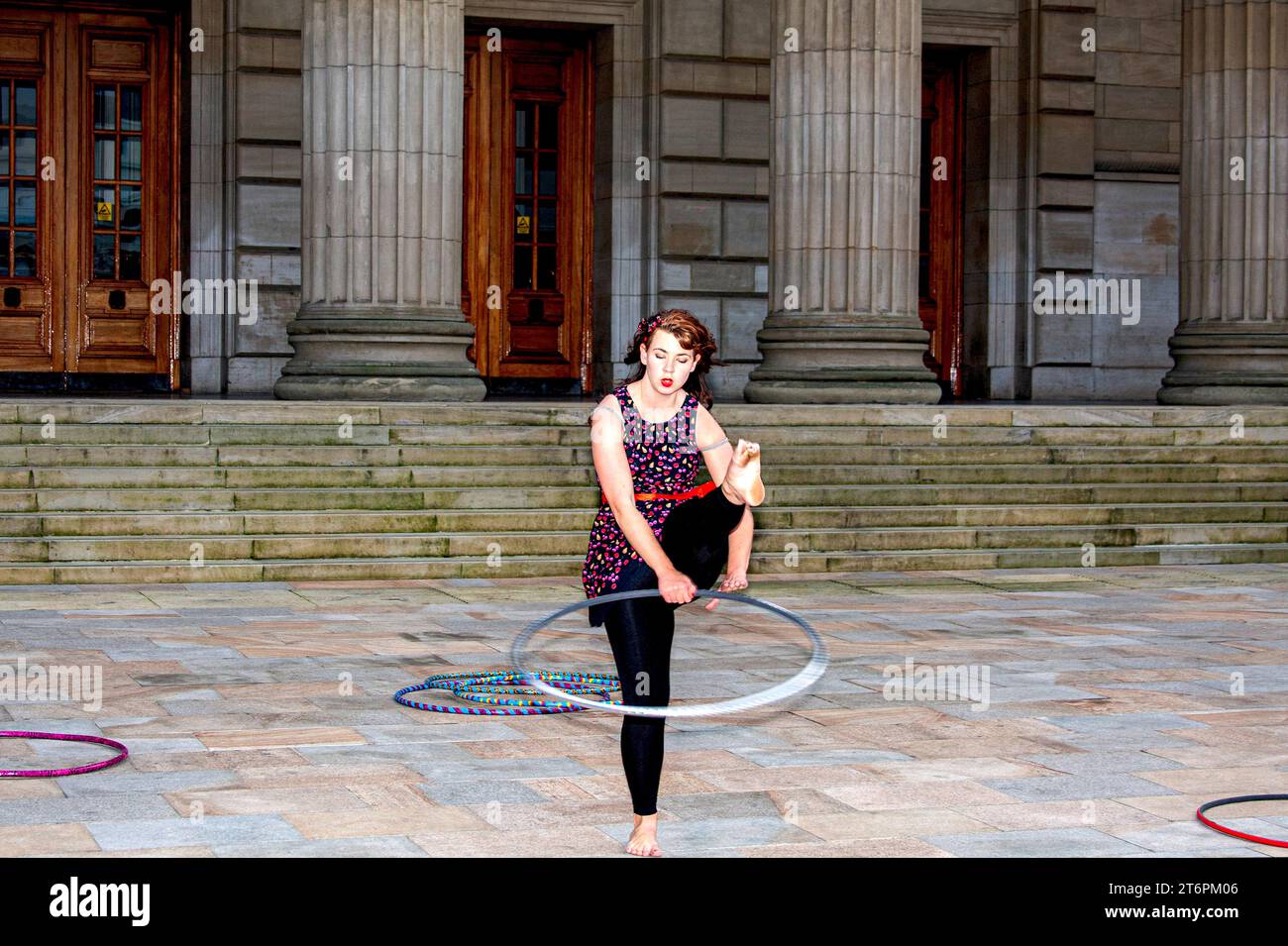 A young woman hula hooping at Dundee's City Square in front of the ...