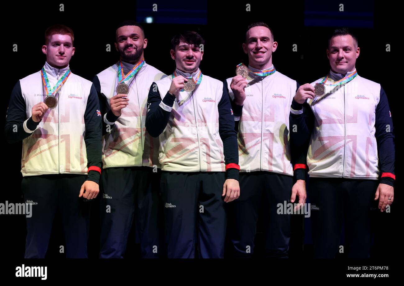 Team Great Britain pose with their Bronze medal on the podium following ...