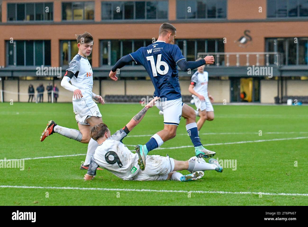 Swansea, Wales. 11 November 2023. Elidon O'Boyle of Millwall is tackled ...