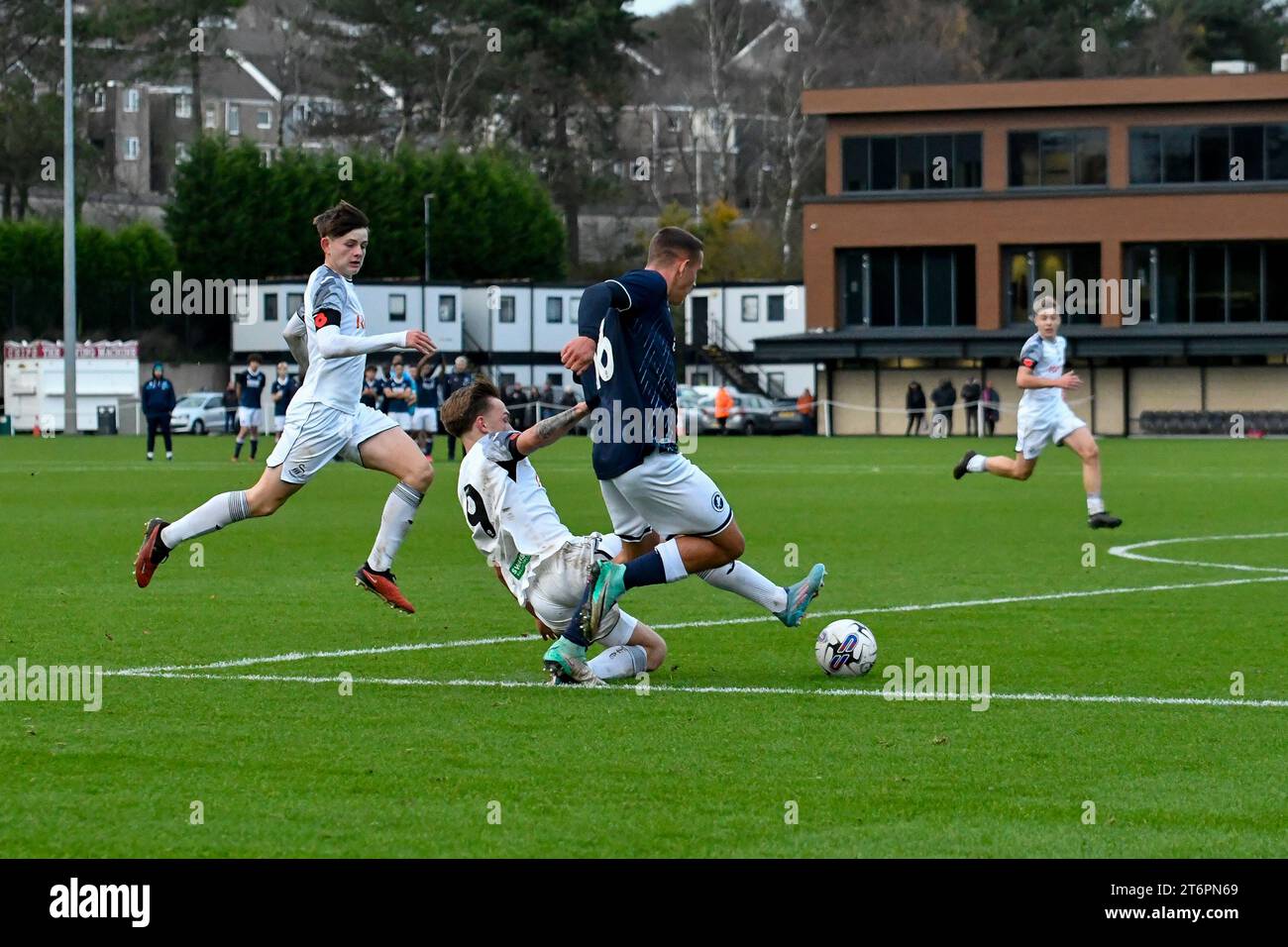 Swansea, Wales. 11 November 2023. Elidon O'Boyle of Millwall is tackled ...