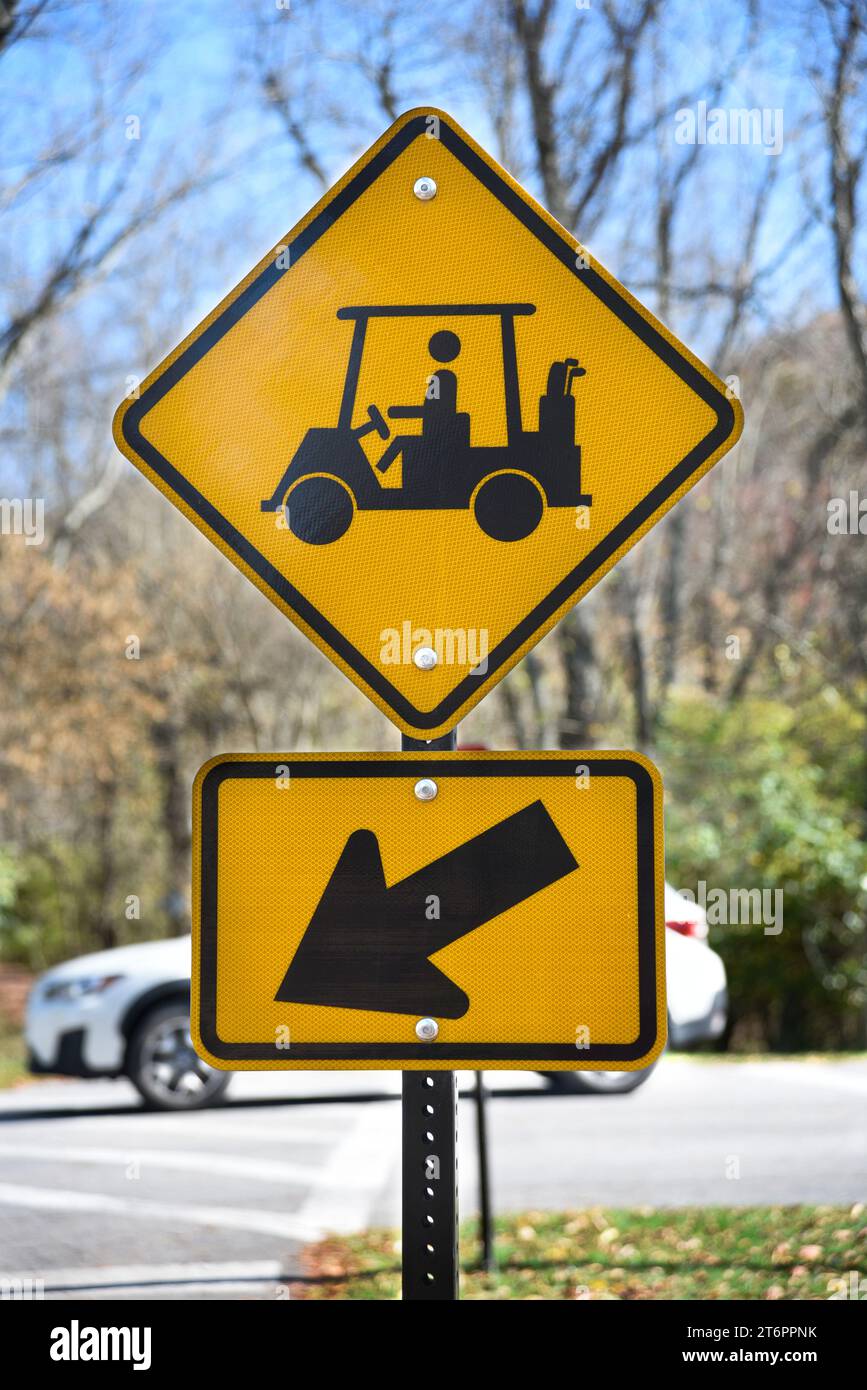 A sign advises motorists that they are approaching a a golf cart ...