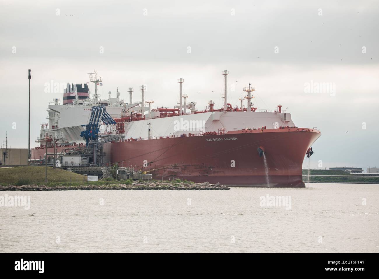 A large tanker ship at dock with anchors up, at surfside, texas, usa ...