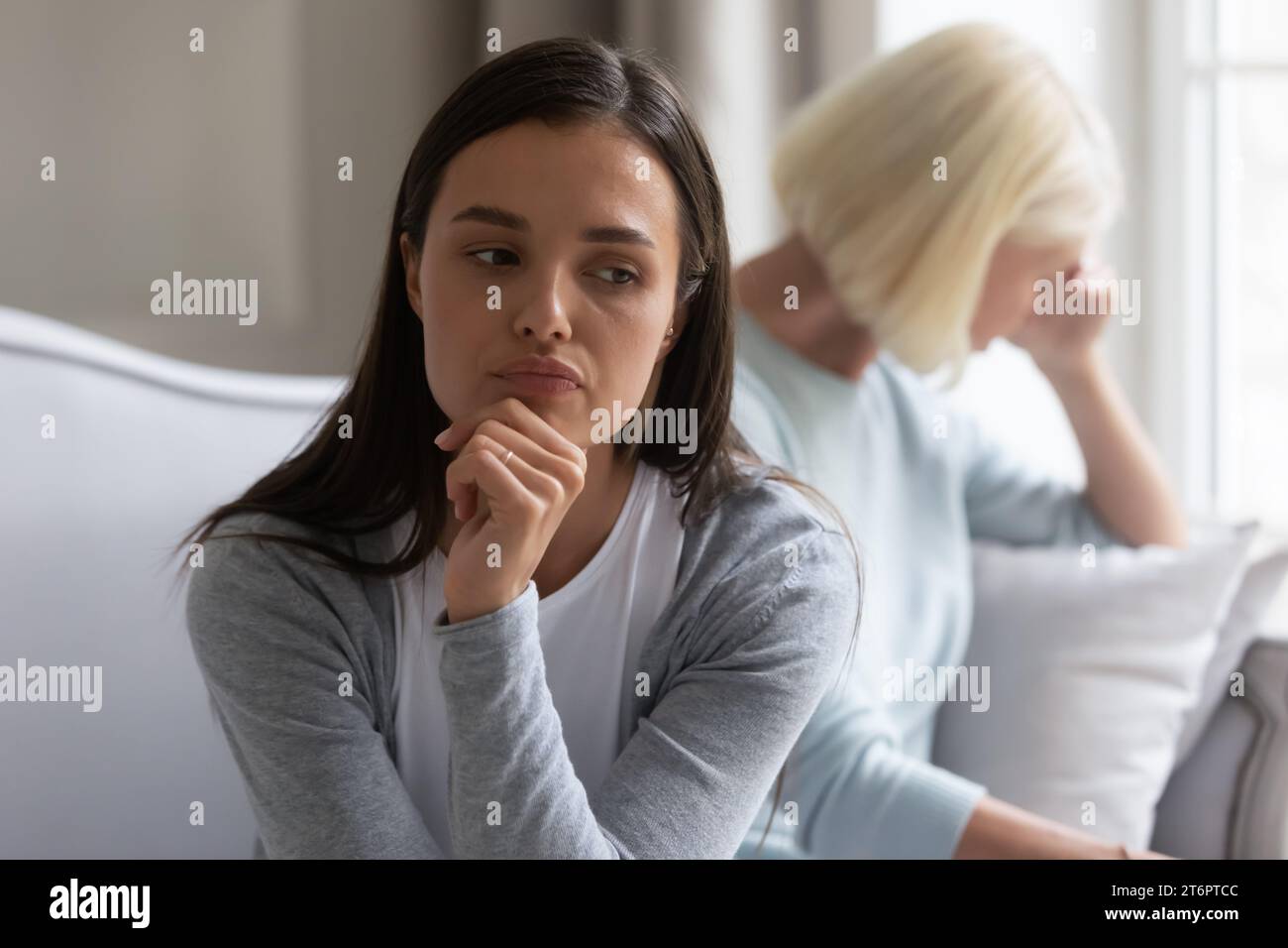 Annoyed selfish young woman ignoring unhappy mature mother after ...