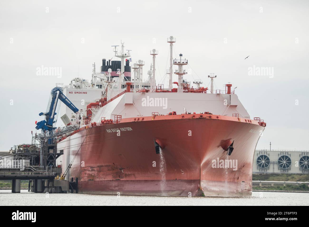 A large tanker ship at dock with anchors up, at surfside, texas, usa ...