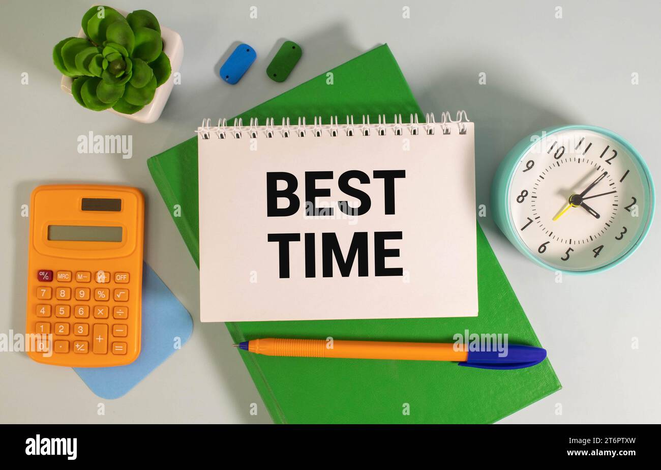 BEST TIME Text written on card with notebook and clipboard, grey ...