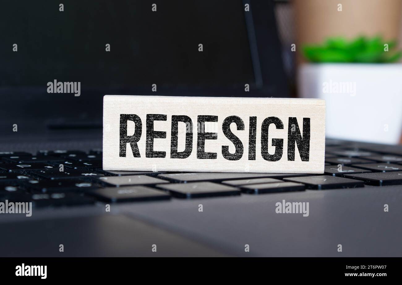 REDESIGN word written on wood block. REDESIGN text on wooden table for ...