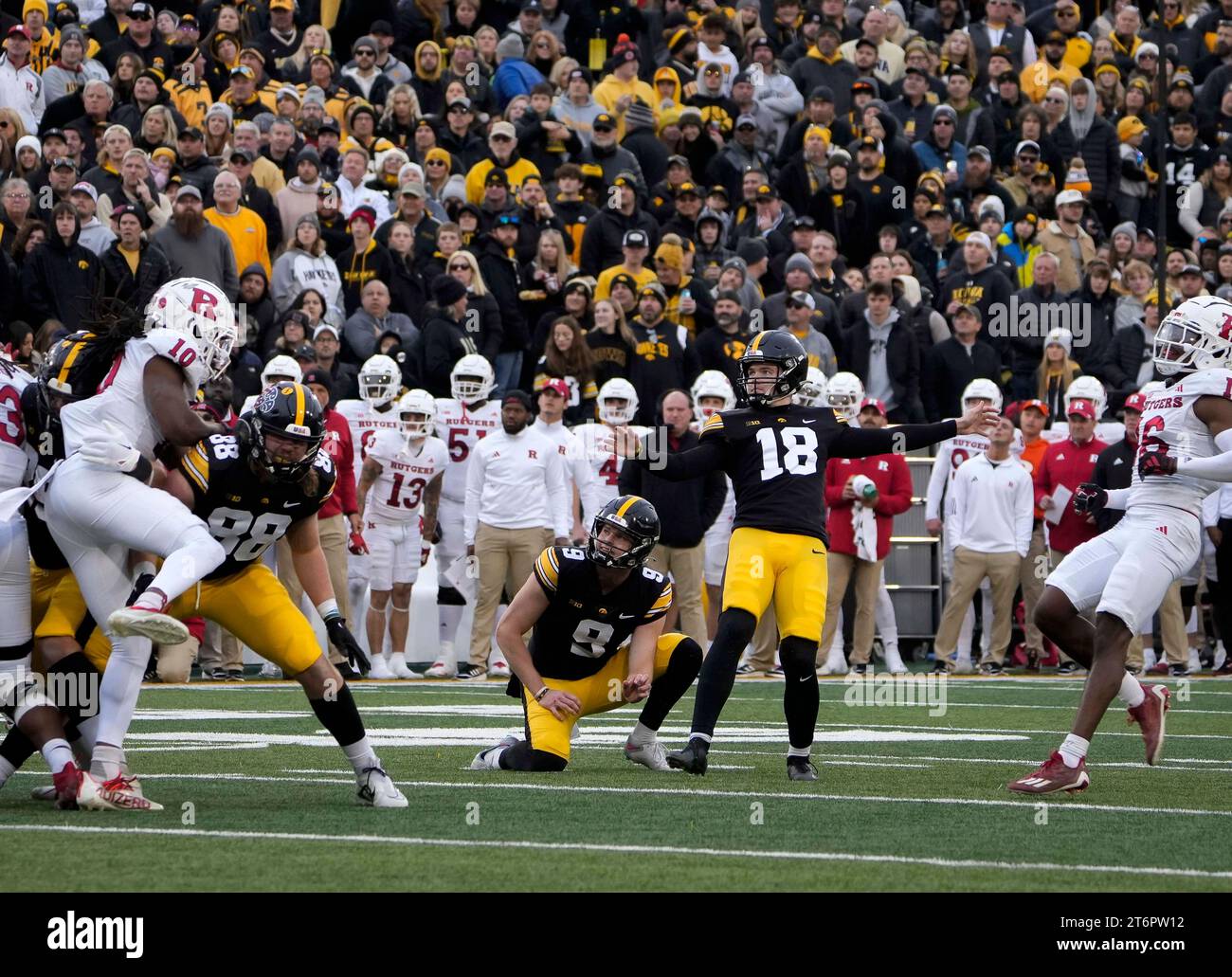 Iowa place-kicker Drew Stevens (18) watches his field goal against ...