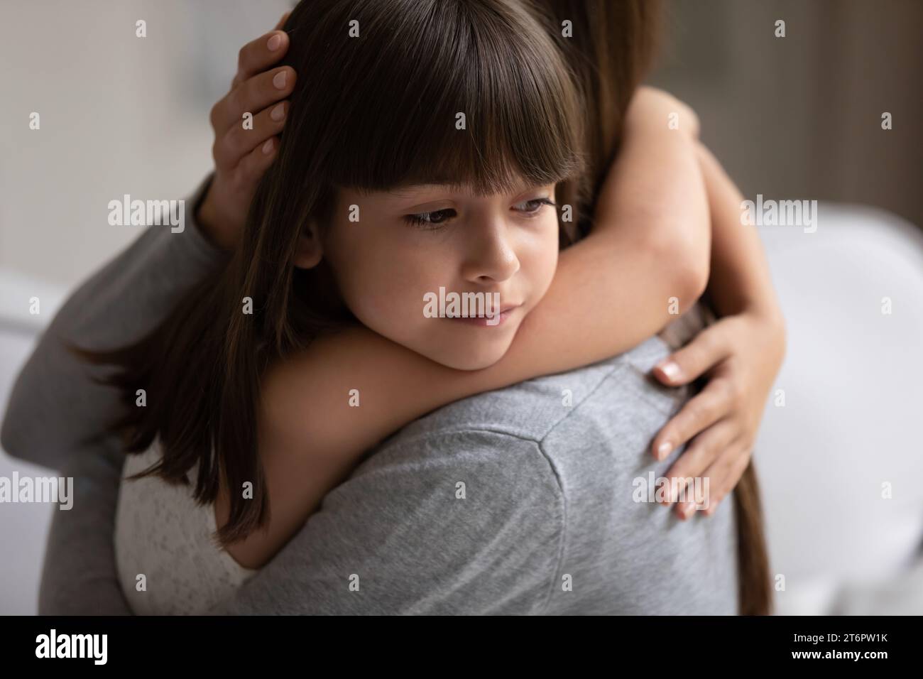 Close up loving mother comforting hugging upset little daughter Stock Photo - Alamy