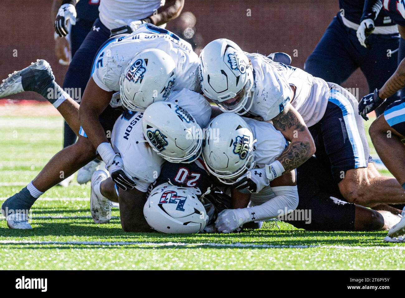 Liberty's Quinton Cooley is brought down by a host of Old Dominion ...