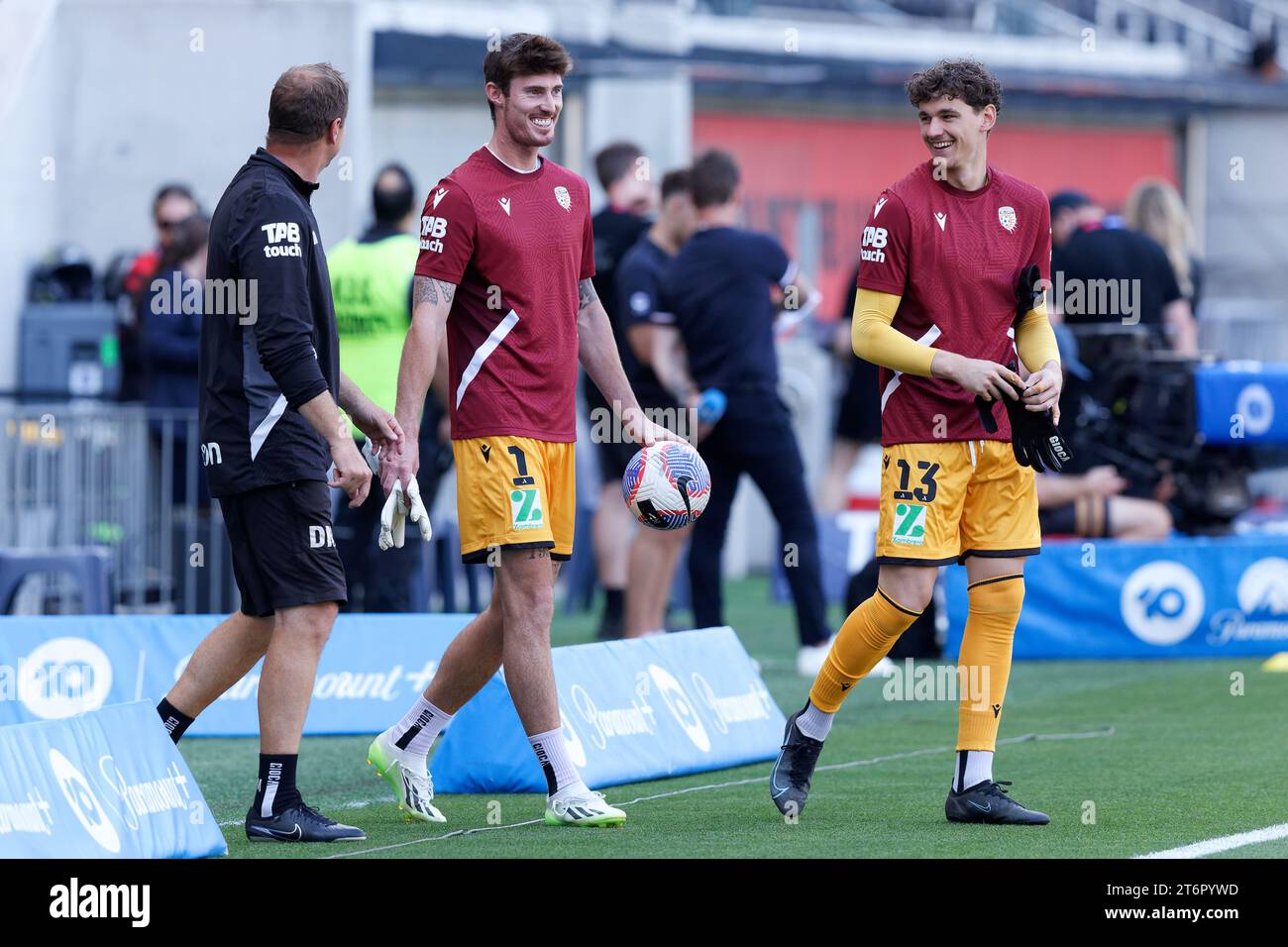 Oliver Sail and Cameron Cook of Perth Glory walk onto the pitch to warm ...