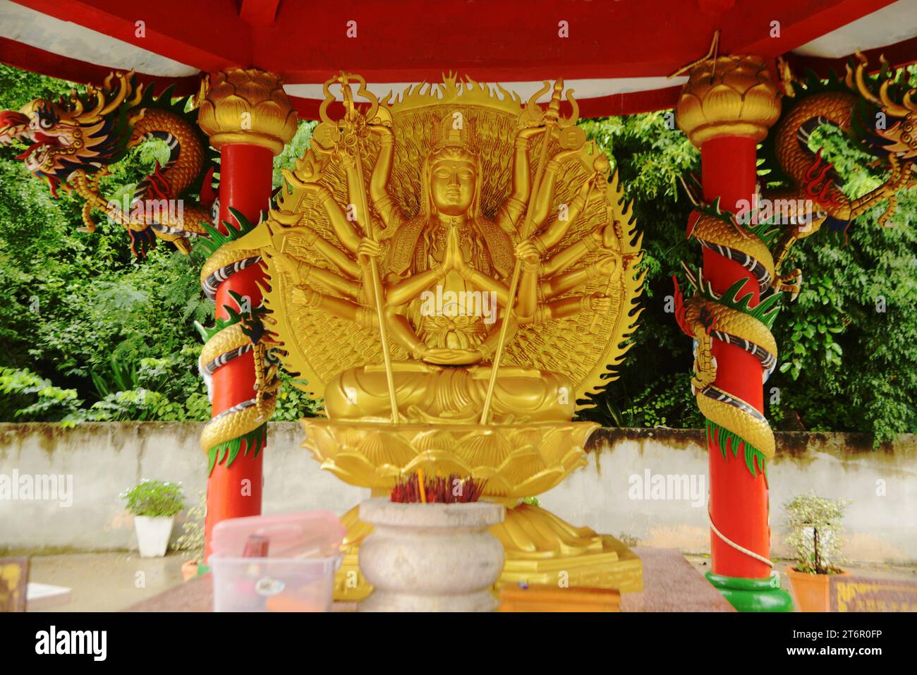 Guan Yin with a thousand golden hands carved from wood.Decorated in a ...