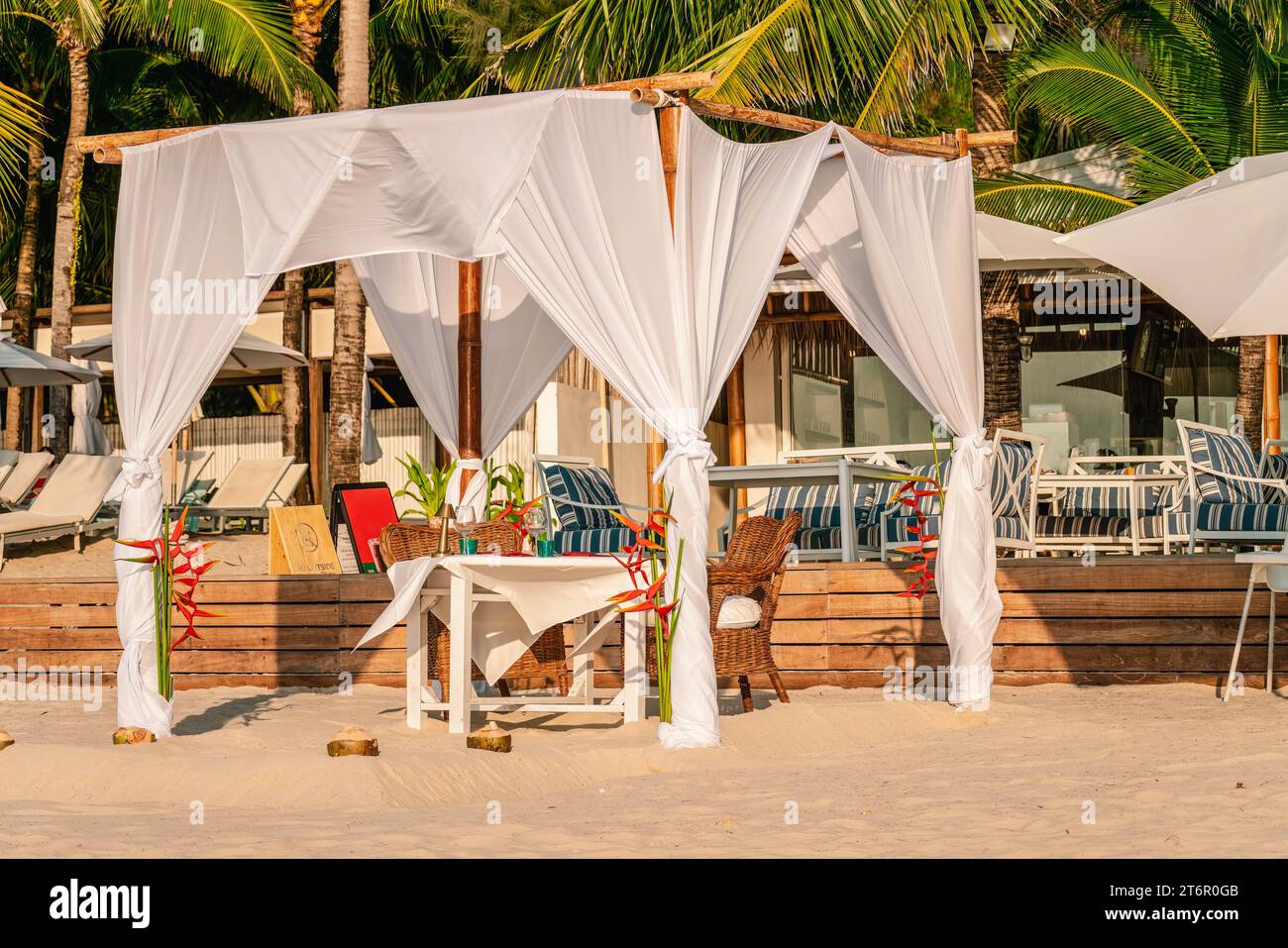 Luxury resort hotel outdoor restaurant on the beach, tropical island ...