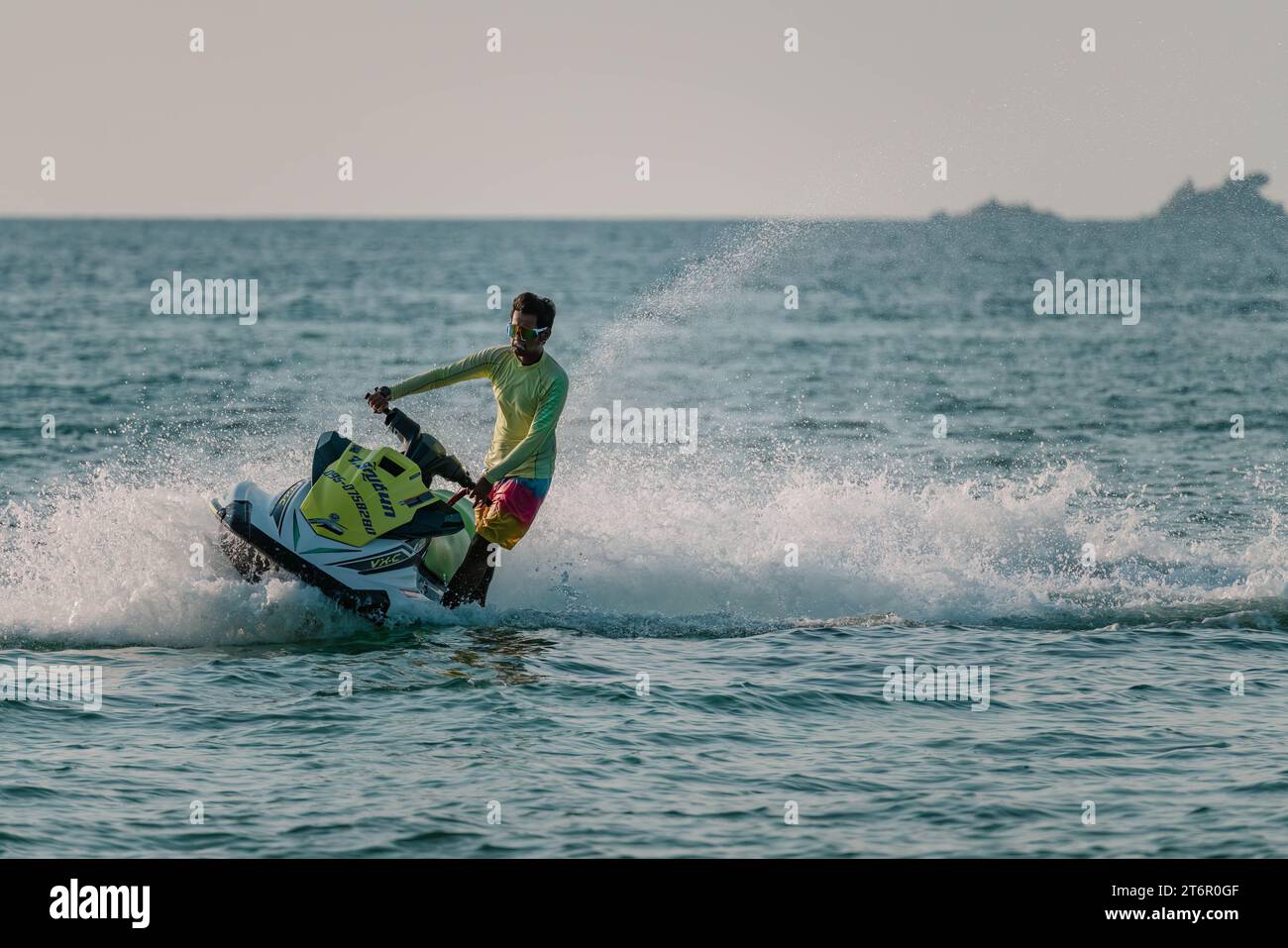 Man standing at a side of jet ski turns to the left side. PHUKET ...
