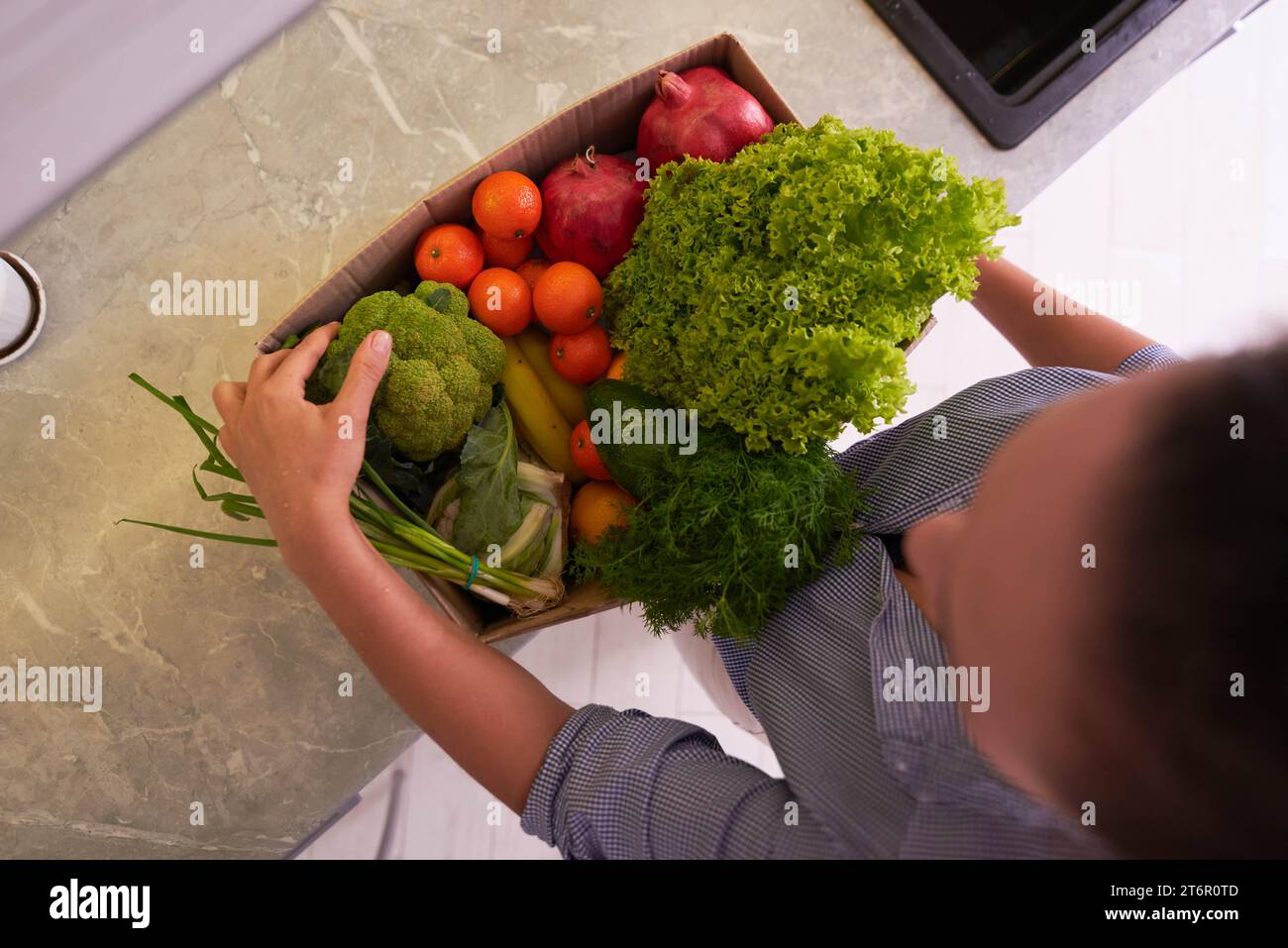 Woman sorting groceries top hi-res stock photography and images - Alamy