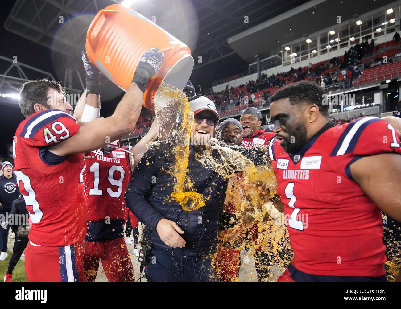 Montreal Alouettes linebacker Frederic Chagnon (49) douses head coach ...
