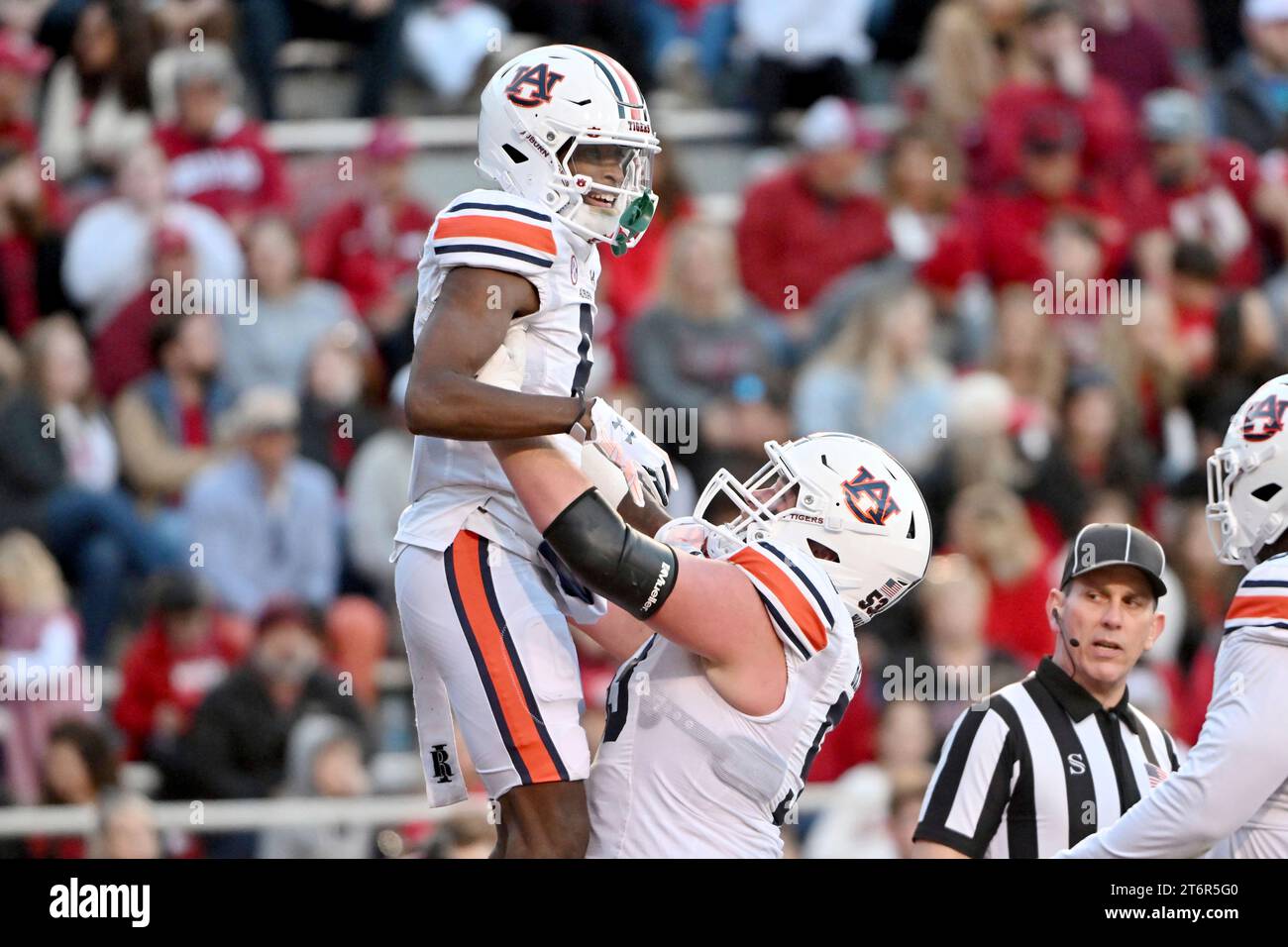 Auburn wide receiver Ja'Varrius Johnson (6) is lifted by teammate ...
