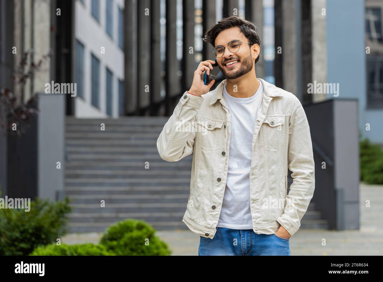 Young Indian man having remote conversation communicate speaking by ...