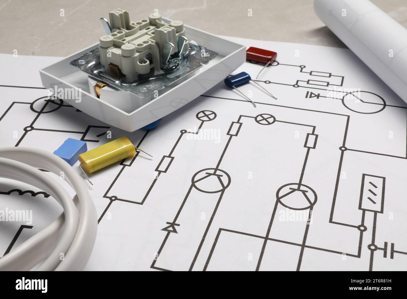 Wiring diagrams, wires and disassembled light switch on table, closeup ...