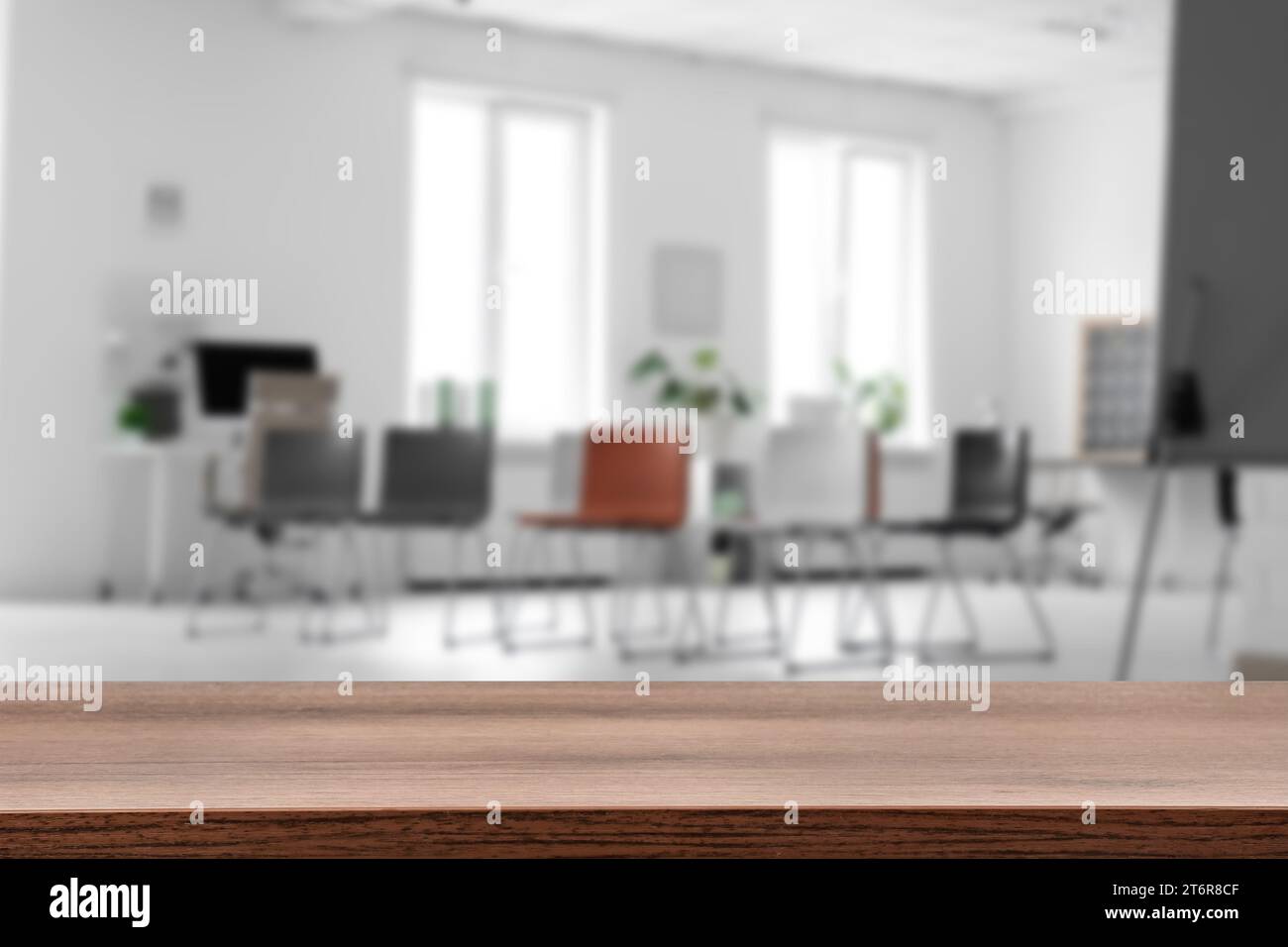 Empty wooden table in comfortable office. Space for design Stock Photo ...
