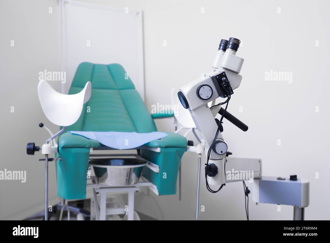 Modern binocular colposcope and gynecological chair in clinic Stock ...
