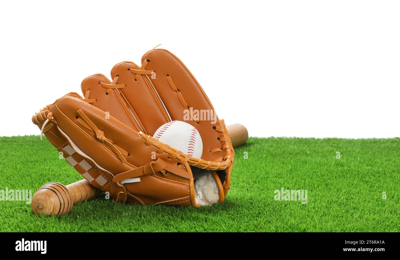 Baseball bat, ball and catcher's mitt on artificial grass against white ...
