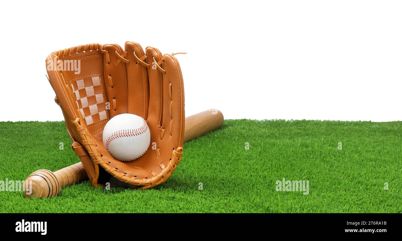 Baseball bat, ball and catcher's mitt on artificial grass against white ...