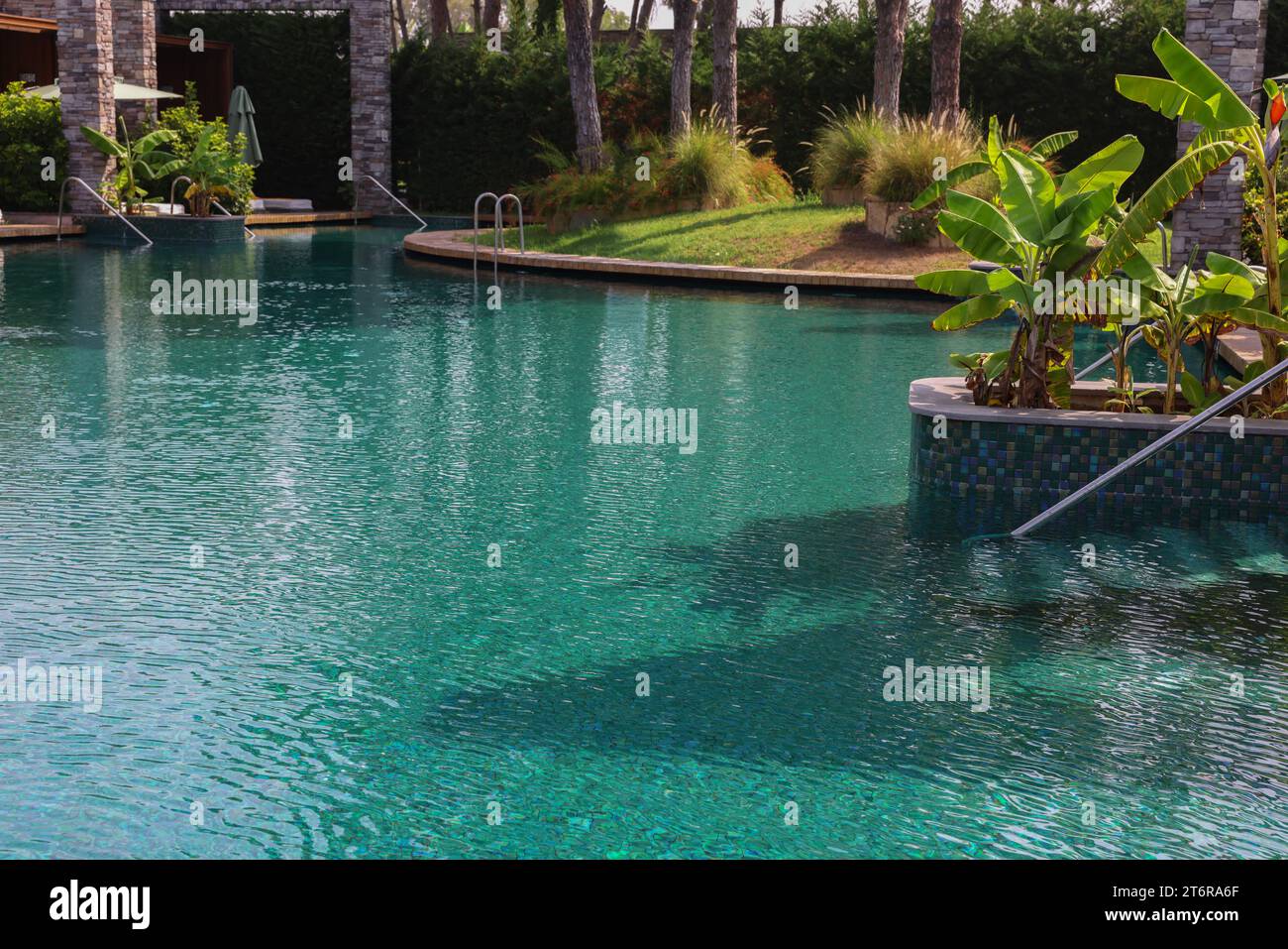 Outdoor swimming pool on sunny day. Luxury resort Stock Photo - Alamy