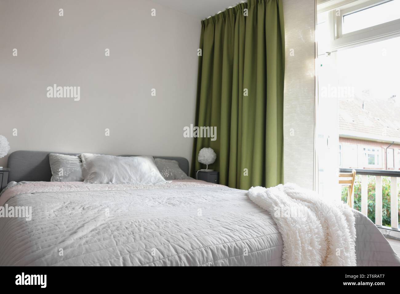 Stylish room interior with comfortable large bed Stock Photo - Alamy