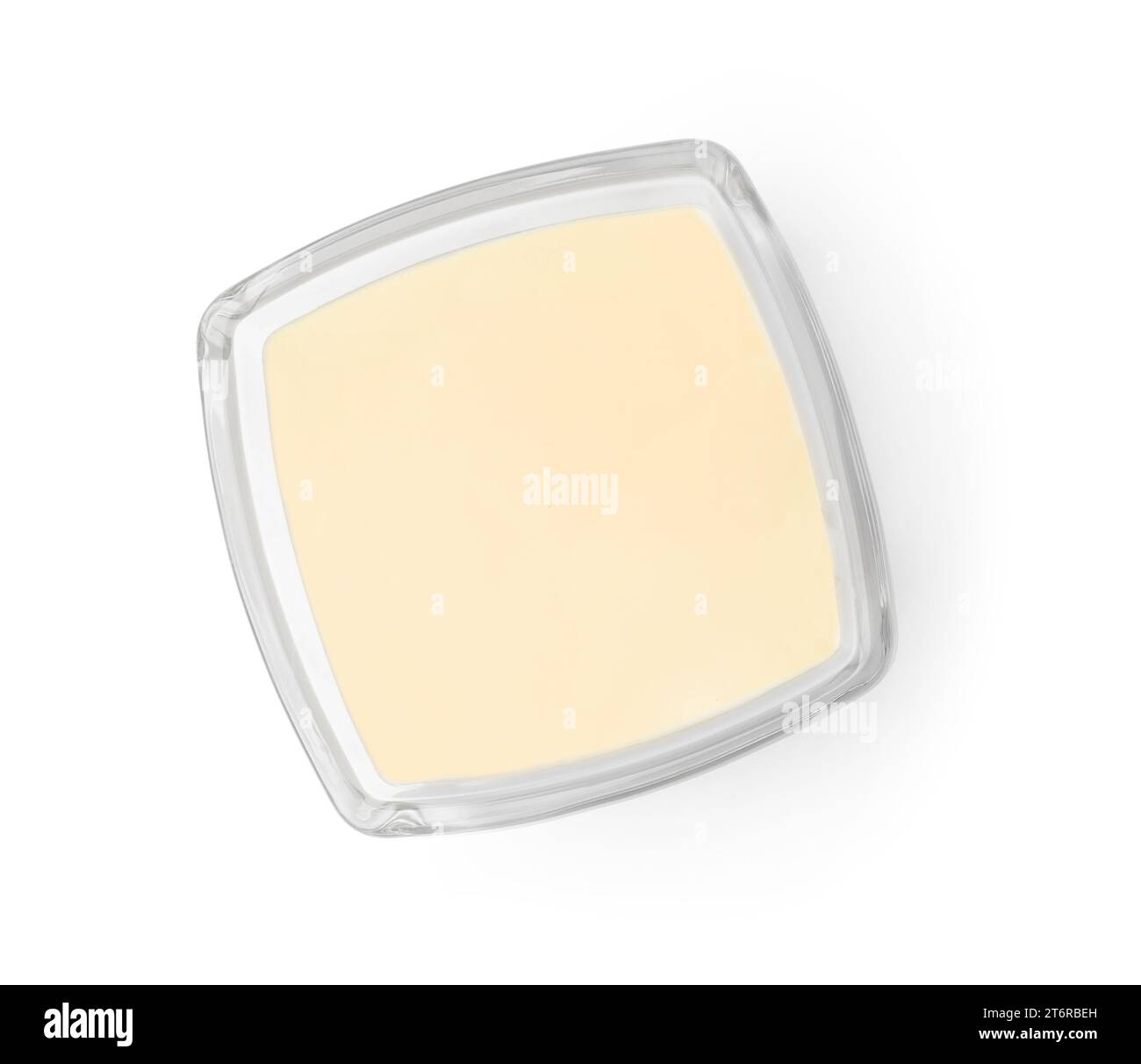 Glass bowl with condensed milk isolated on white, top view Stock Photo ...