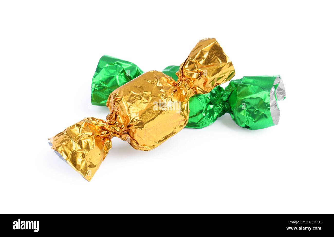 Tasty candies in colorful wrappers isolated on white Stock Photo - Alamy