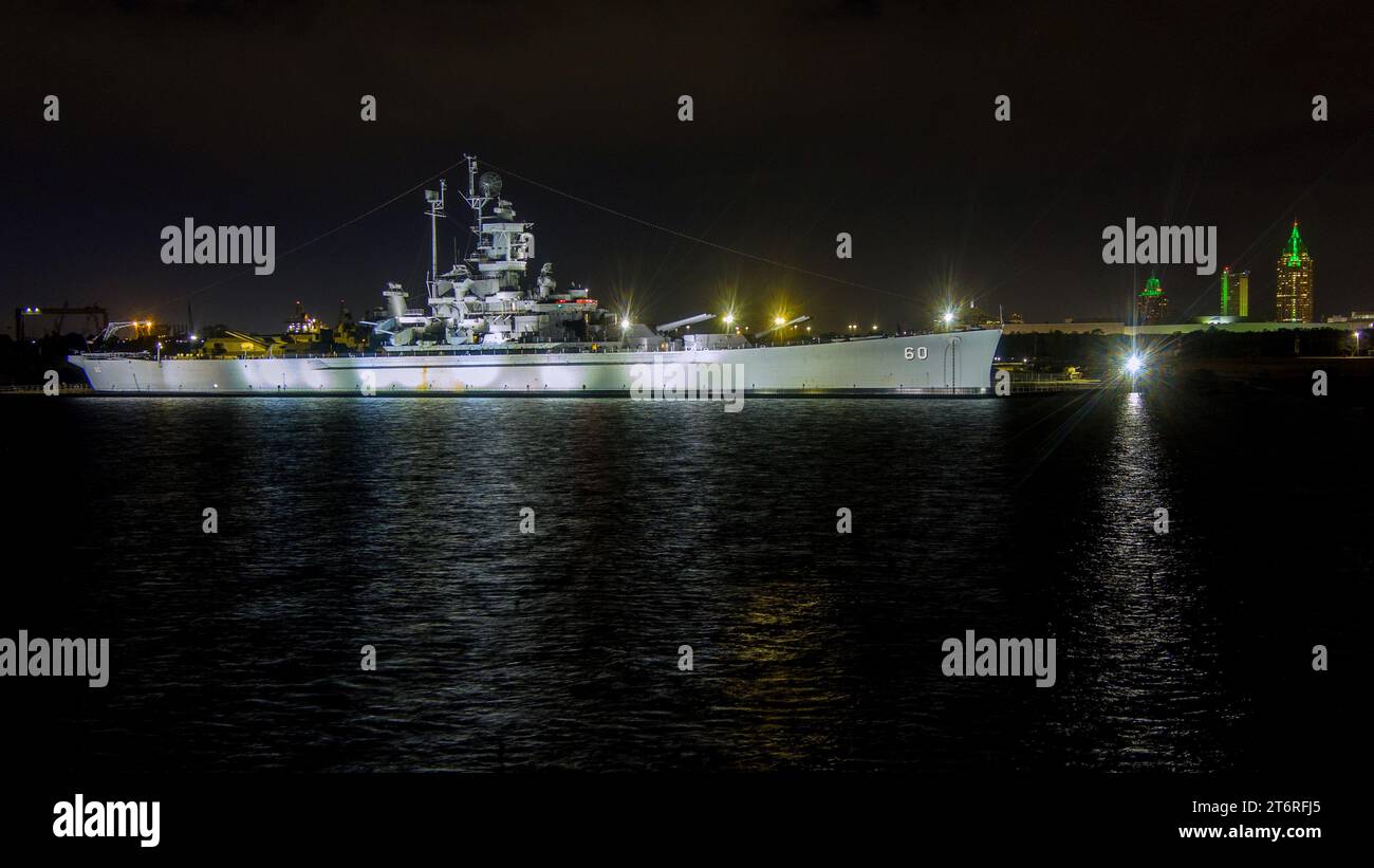 Aerial view of the USS Alabama battleship and the Mobile skyline at ...