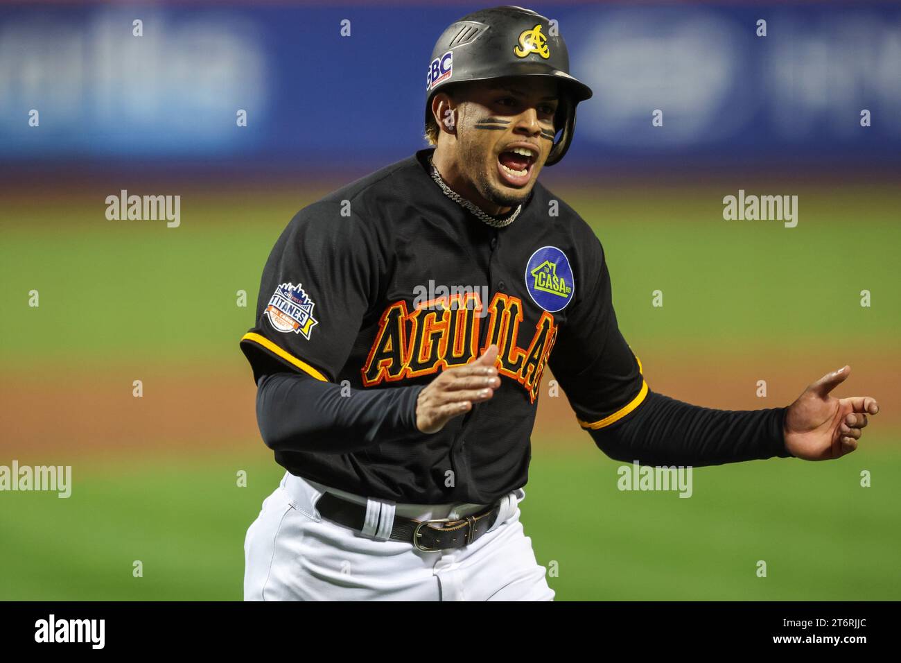 Las Águilas Cibaeñas Christopher Morel (95) scores on a sacrifice fly ...