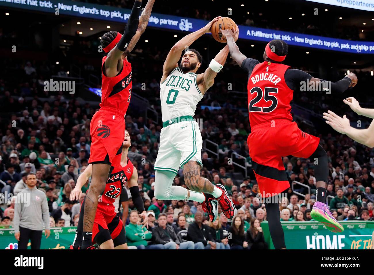 Boston Celtics' Jayson Tatum (0) shoots against Toronto Raptors' Jalen McDaniels (2) and Chris ...